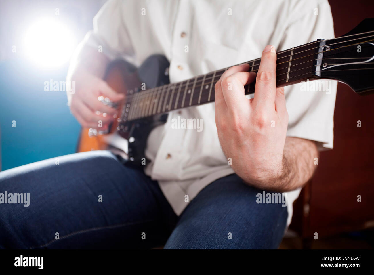 Guitarist on stage in the stagelight Stock Photo - Alamy
