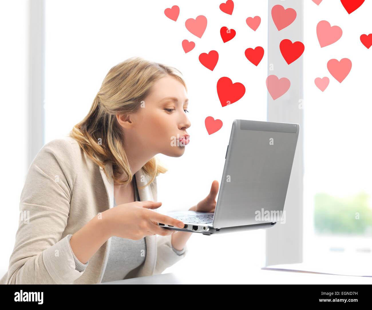Woman kisses computer hi-res stock photography and images - Alamy