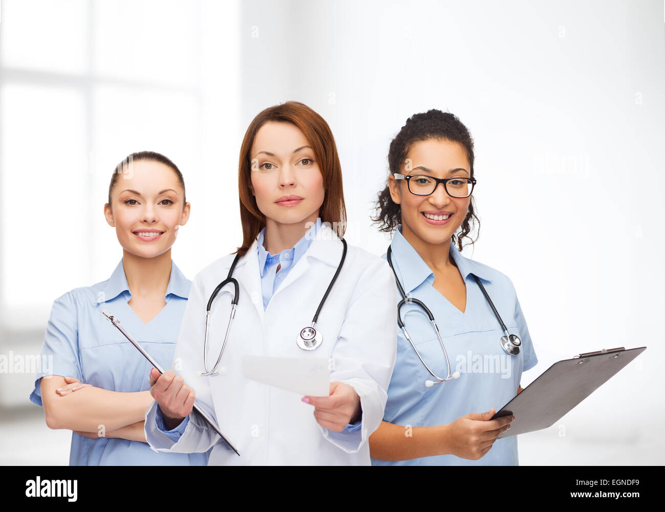 calm female doctor with clipboard Stock Photo - Alamy