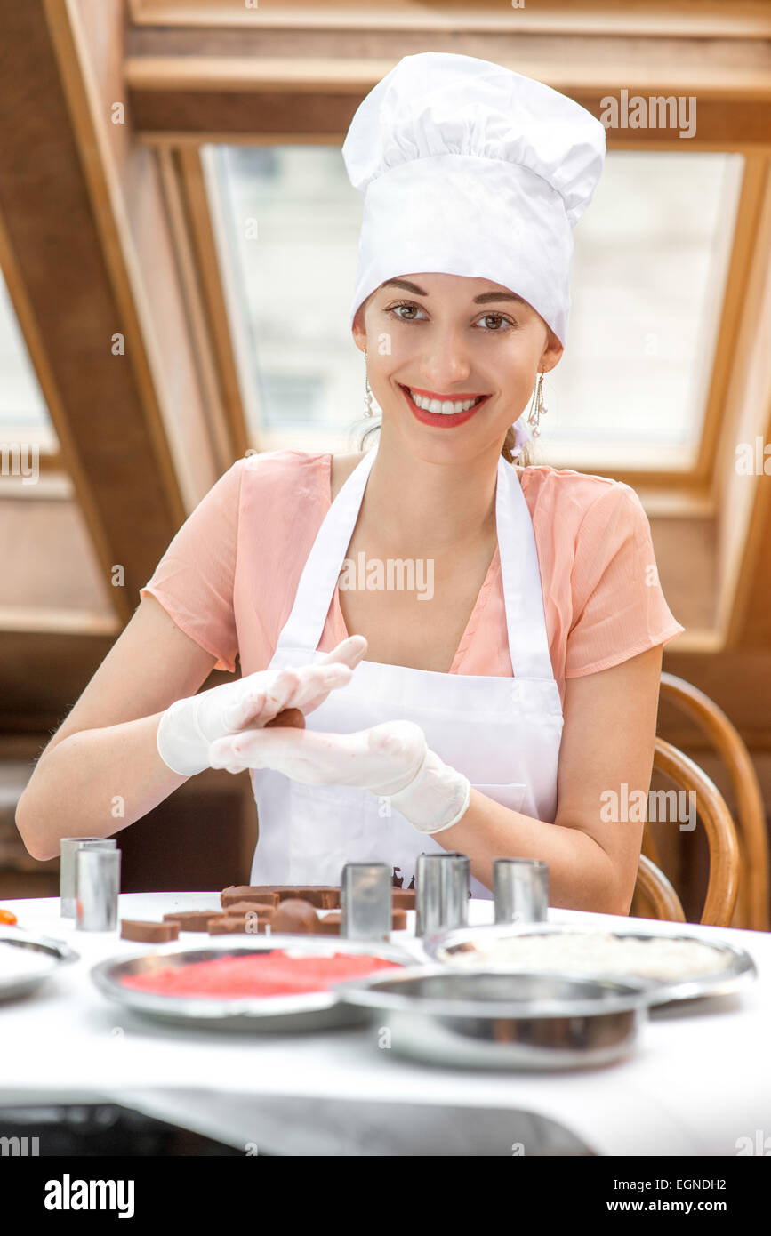 Woman making handmade candy Stock Photo - Alamy