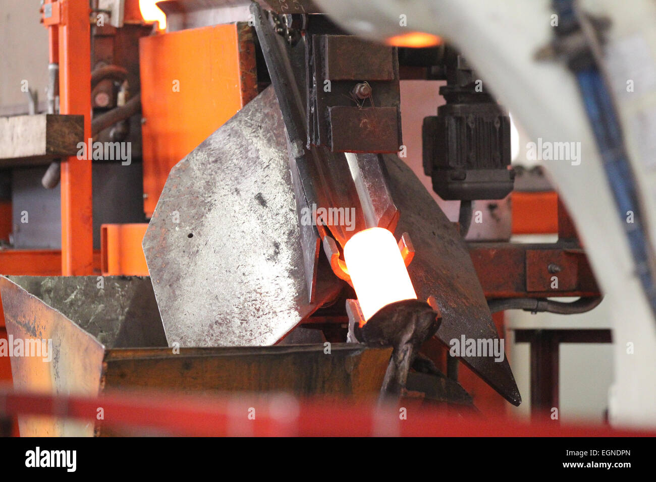 positioning unit and supplying the heated round billet Stock Photo - Alamy