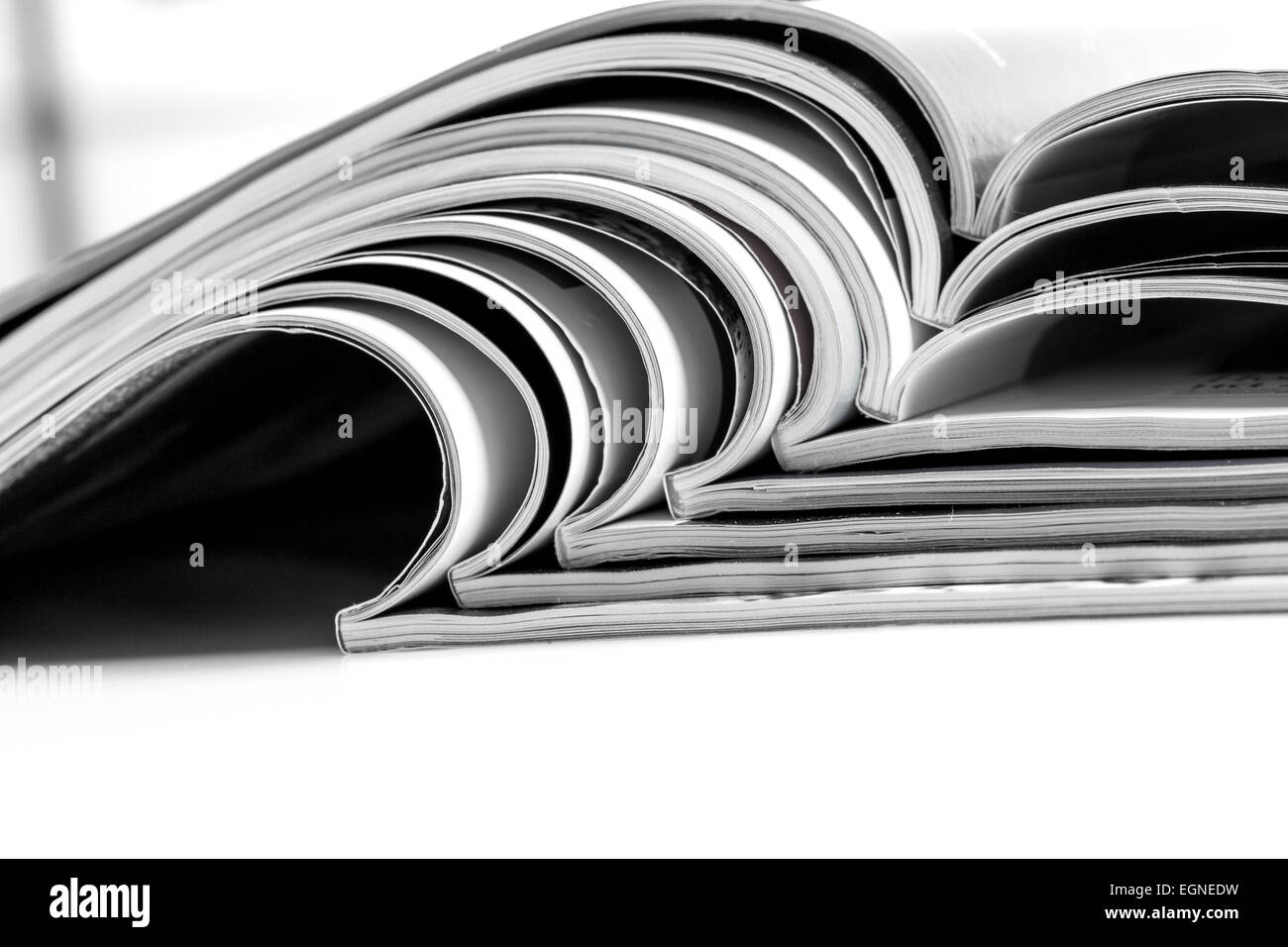 Pile of open magazines isolated on white background hi-res stock ...