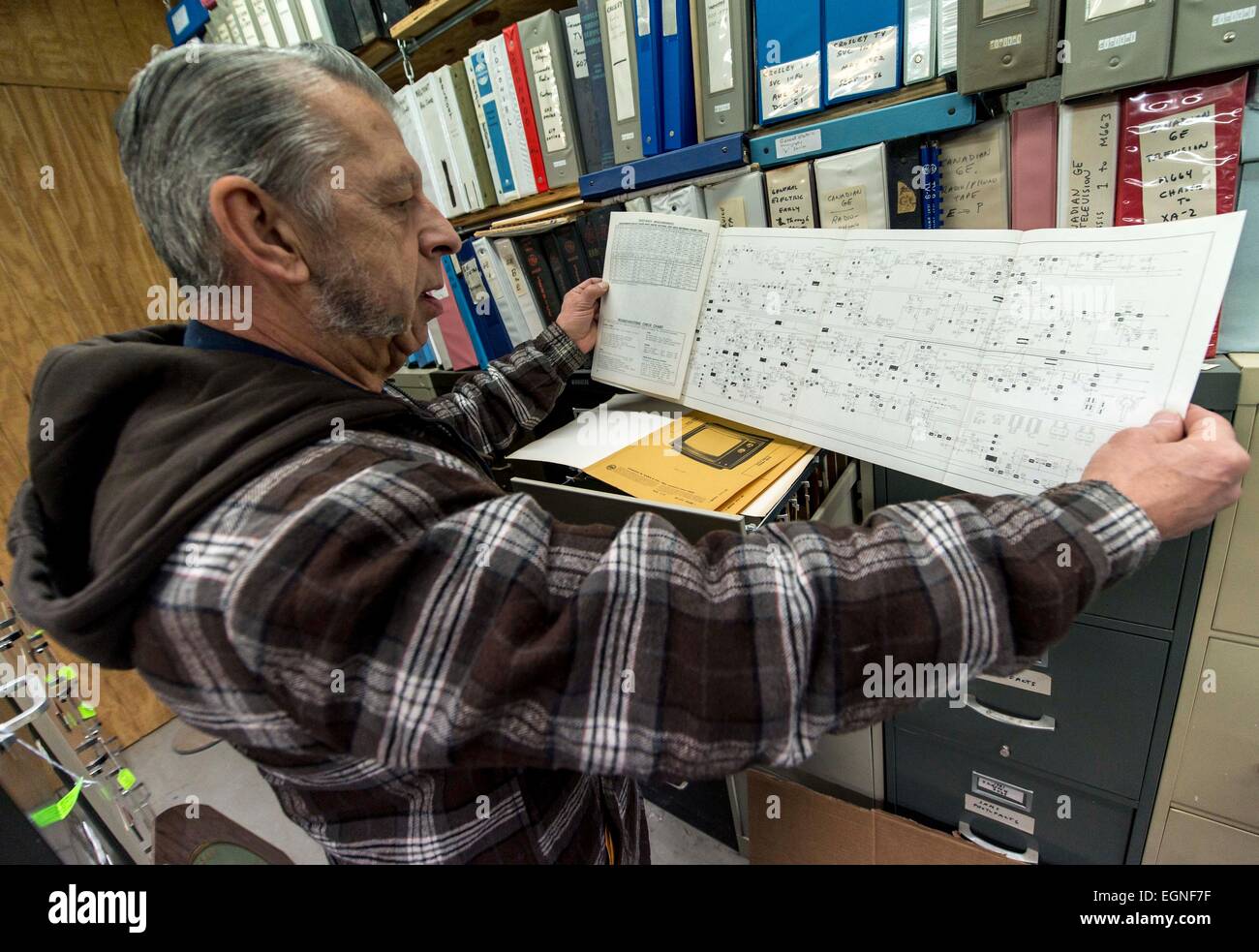 Bowie, MD, USA. 27th Feb, 2015. Volunteer JOE COLICK studies the ...
