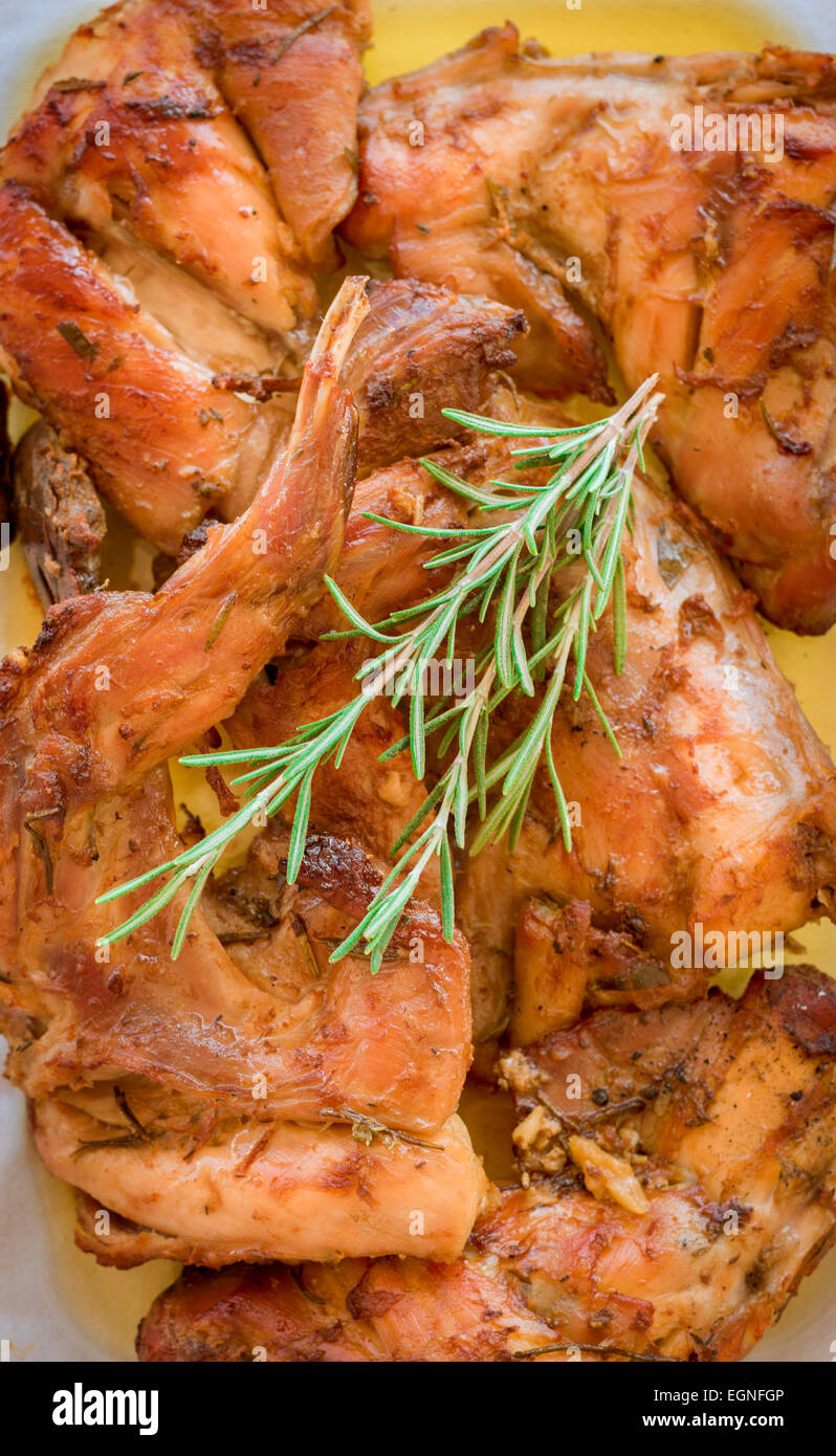 Close up of traditional roasted rabbit with rosemary. Mediterranean ...