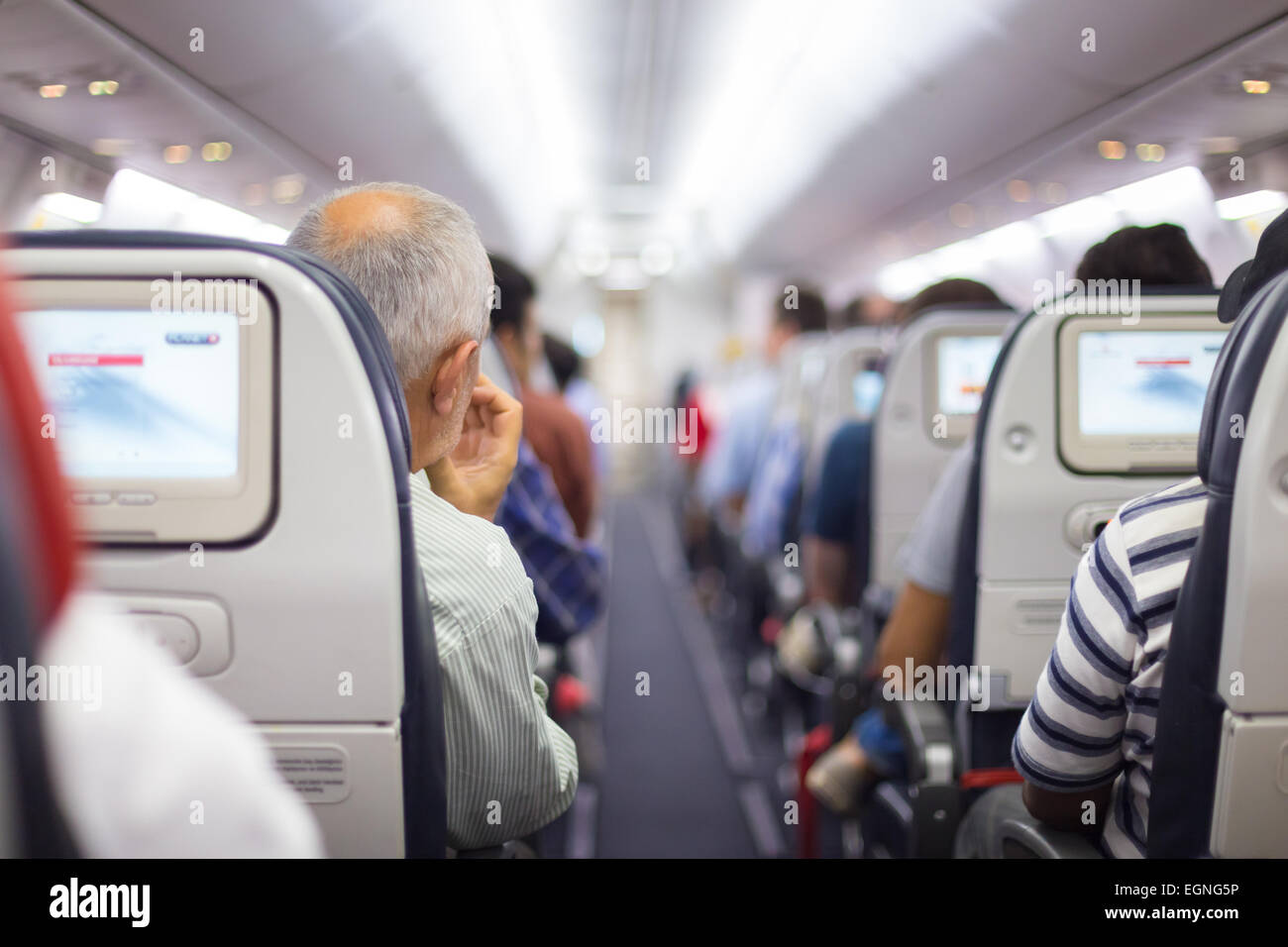 Passengers on the airplane Stock Photo - Alamy