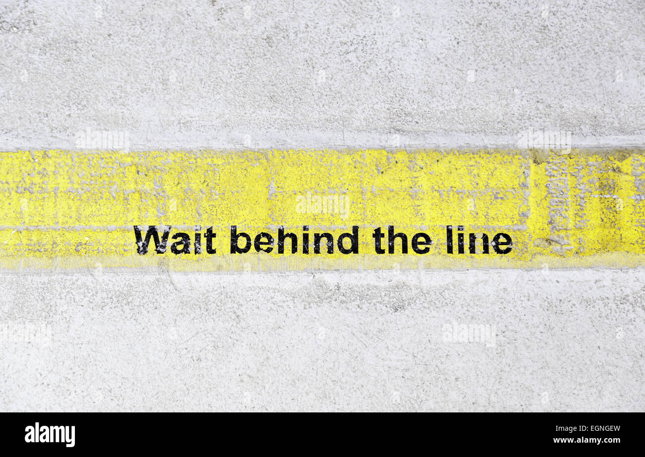 Wait behind the line, a signal detail and safety information Stock ...