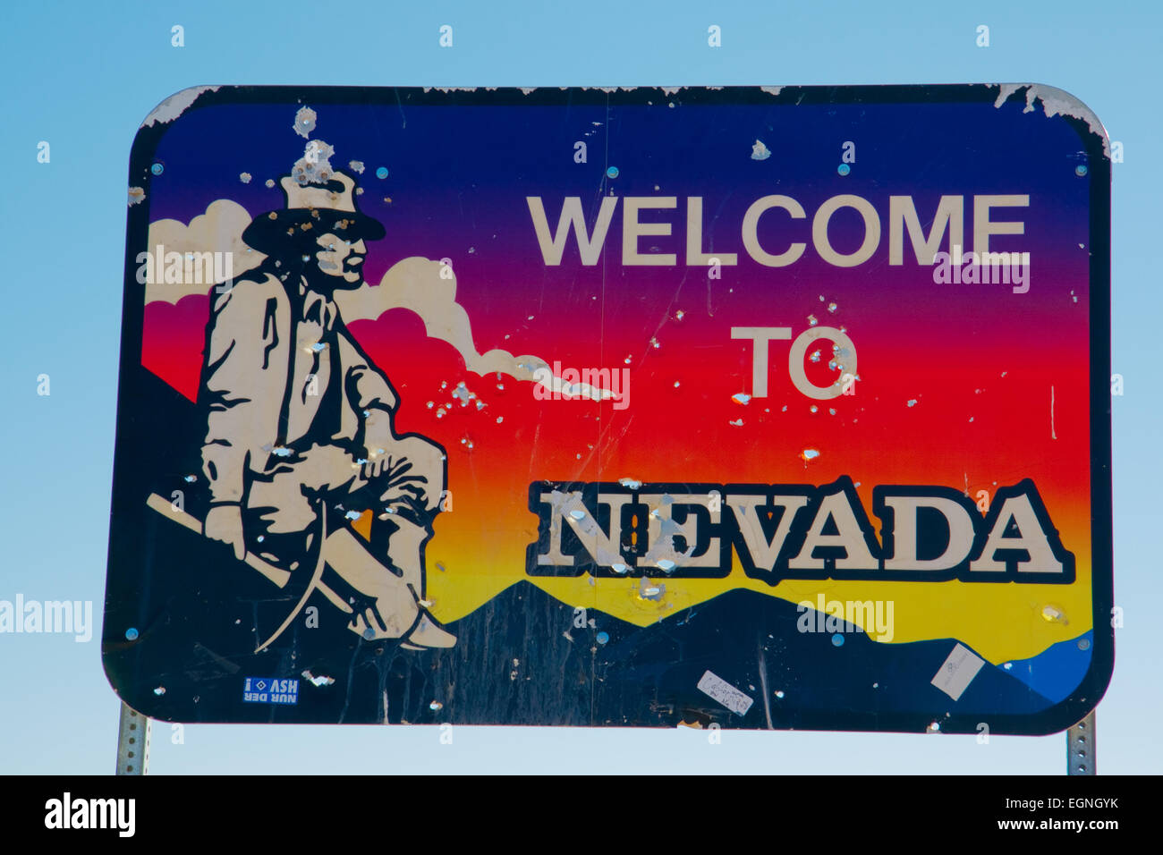 Welcome to Nevada road sign with bullet holes Stock Photo - Alamy