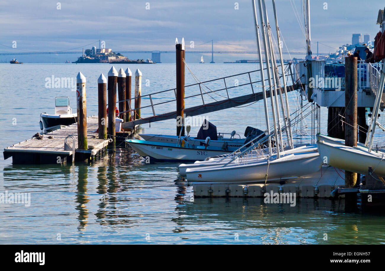 Alcatraz Island and the San Francisco Bay Bridge with a dock and ...