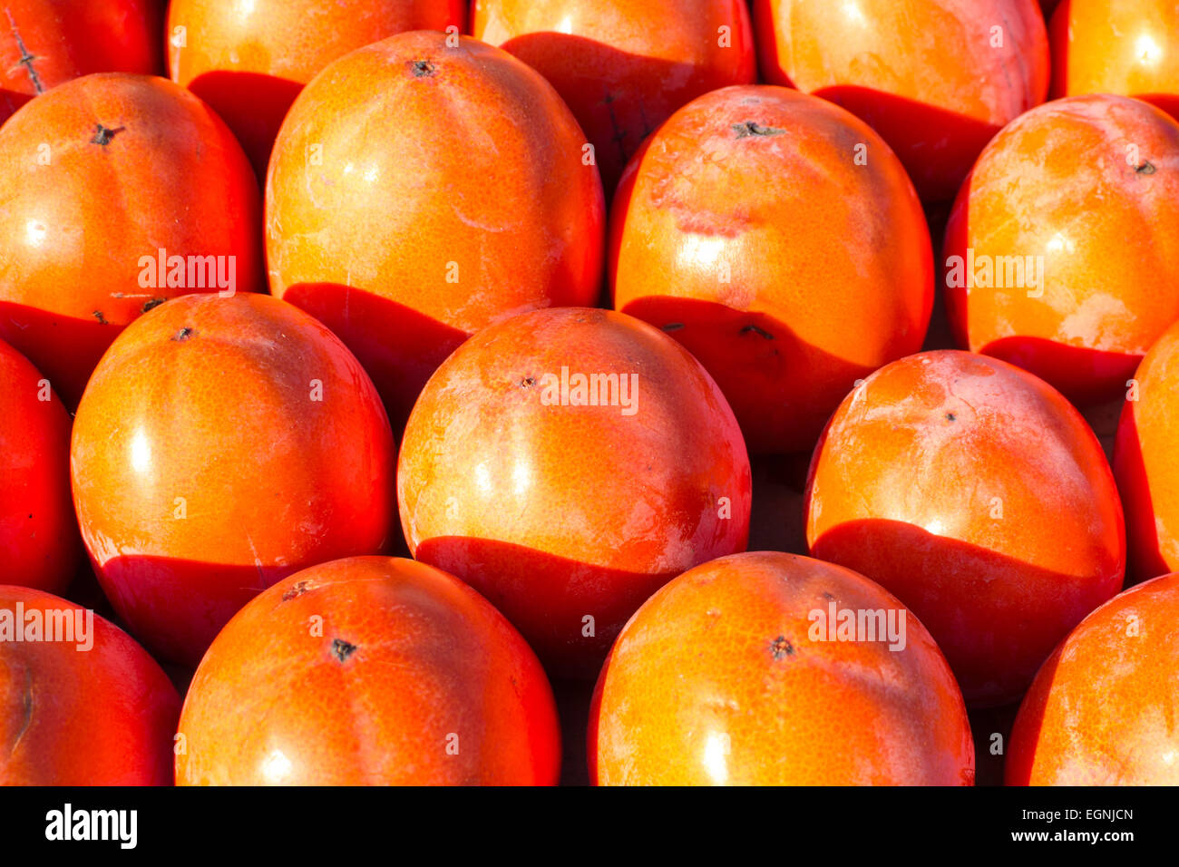 Full frame take of ripe persimon on a street market stall Stock Photo ...