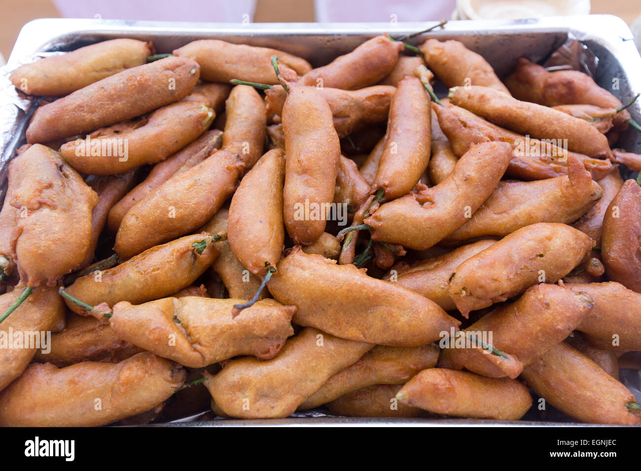 Stuffed Green Chillies dipped in Millet flour batter and deep-fried ...