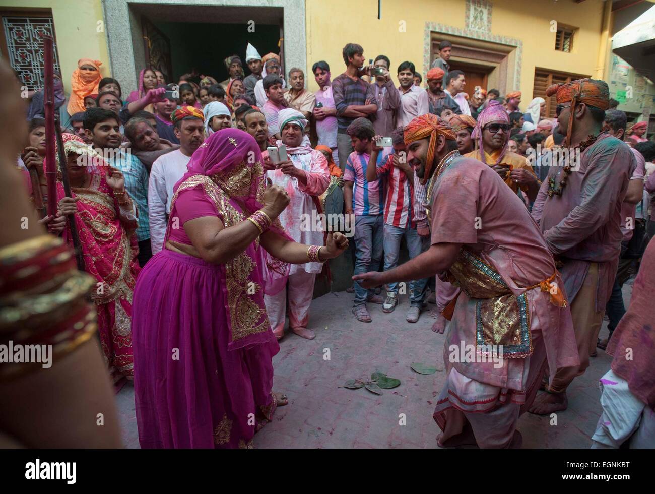 Mathura. 27th Feb, 2015. Indian people dance during the Lathmar Holi ...