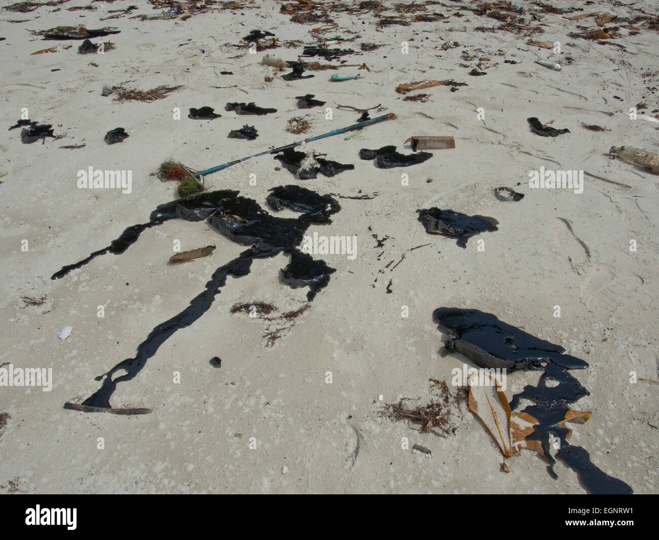 Tar pollution on beach due to oil spillages from shipping in Bintan ...