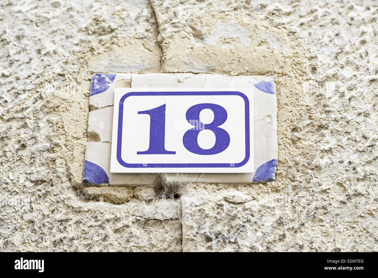 Number eighteen on a wall, detail of a number of information on a wall ...