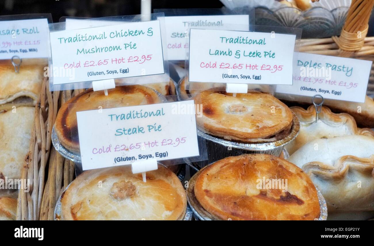 Traditional pies in a shop window england uk Stock Photo - Alamy