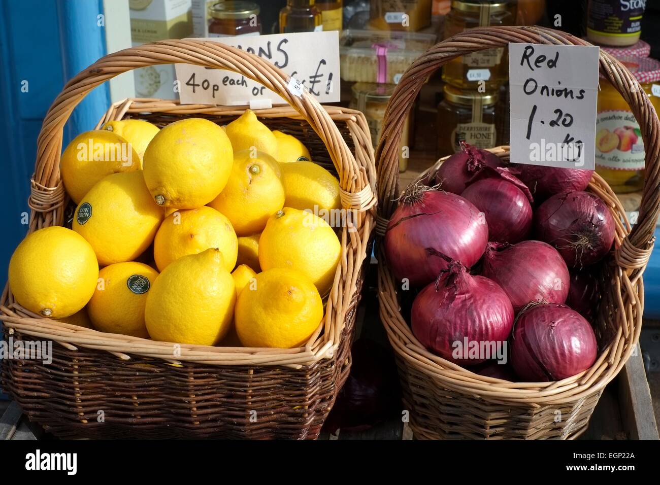 Fresh lemons and onions for sale outside a shop England uk Stock Photo ...