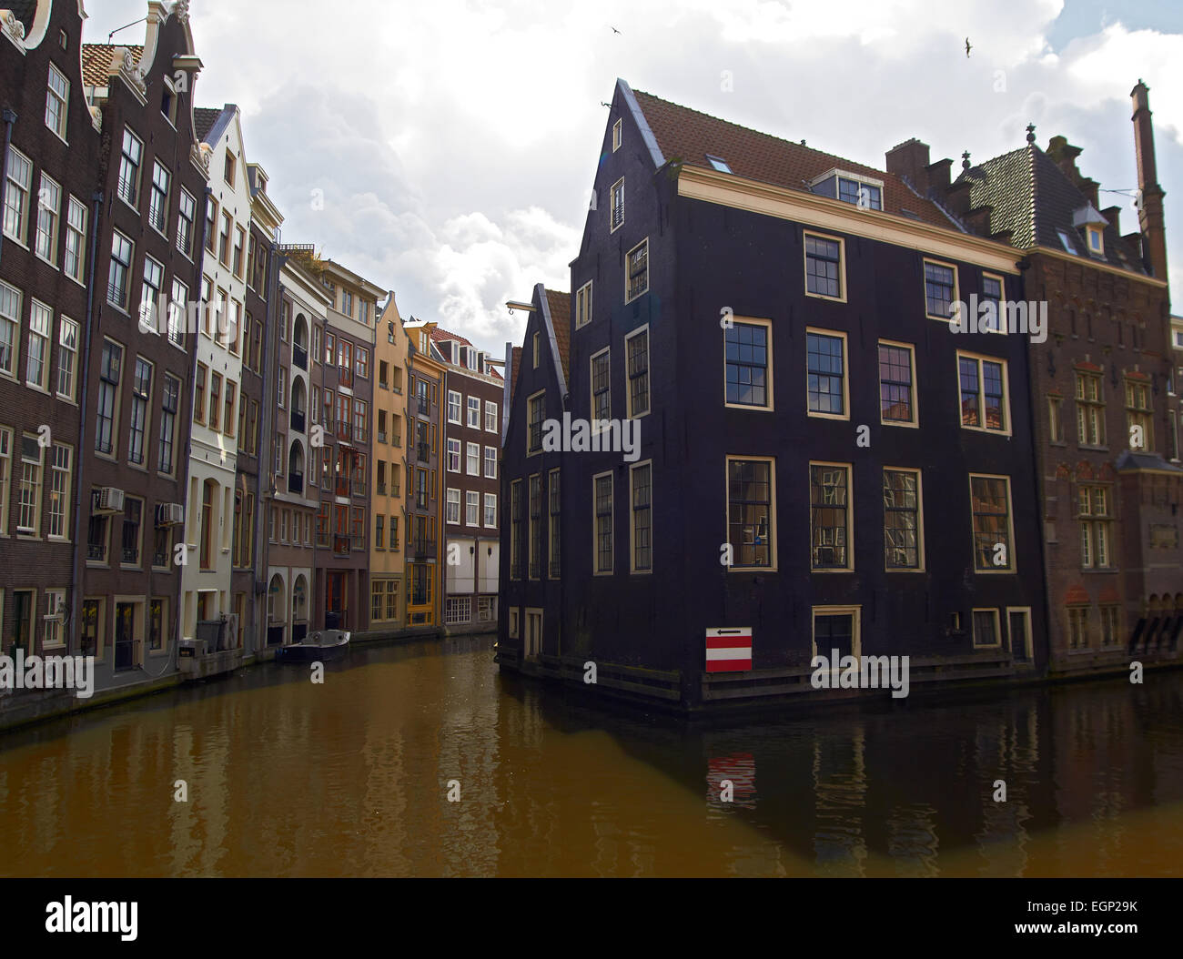 Old Houses and canals at Amsterdam center in cloudy day. Netherlands ...