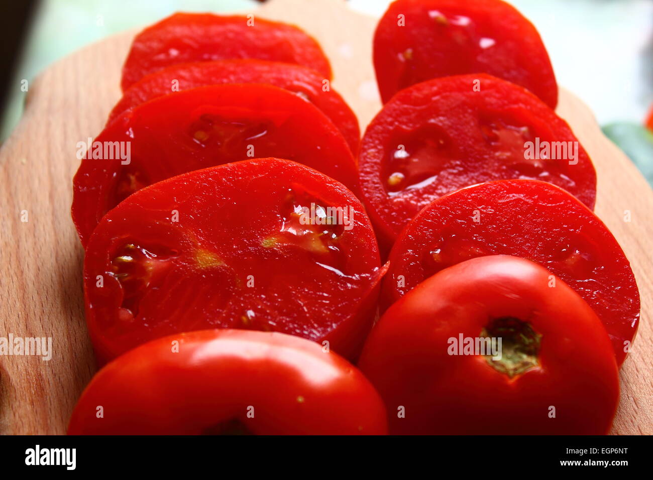 on the board are stacked in two rows of fresh tomatoes cut into rings ...