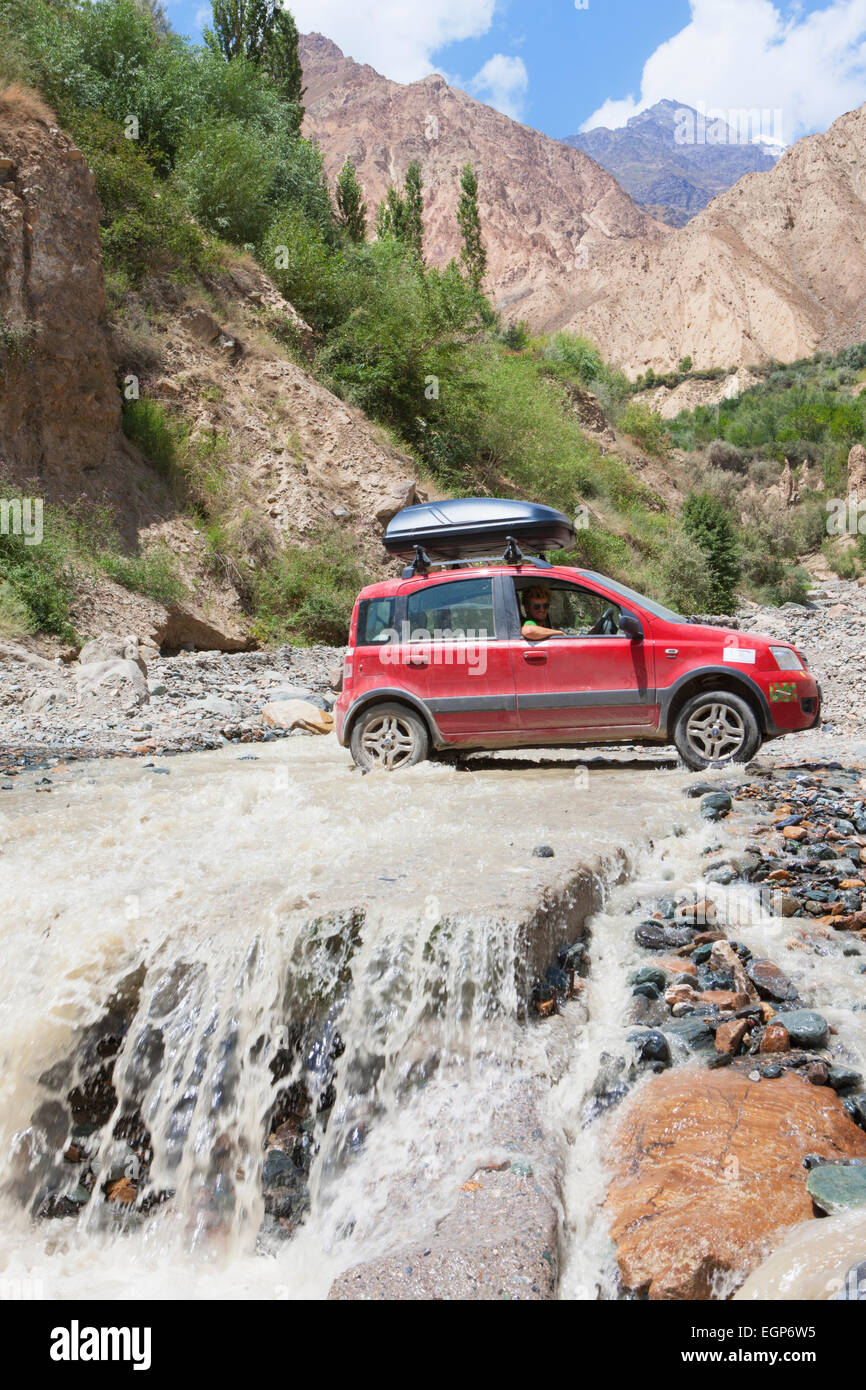 Car crossing Vanch River, Vanch river valley, Pamir Highway, Tajikistan ...