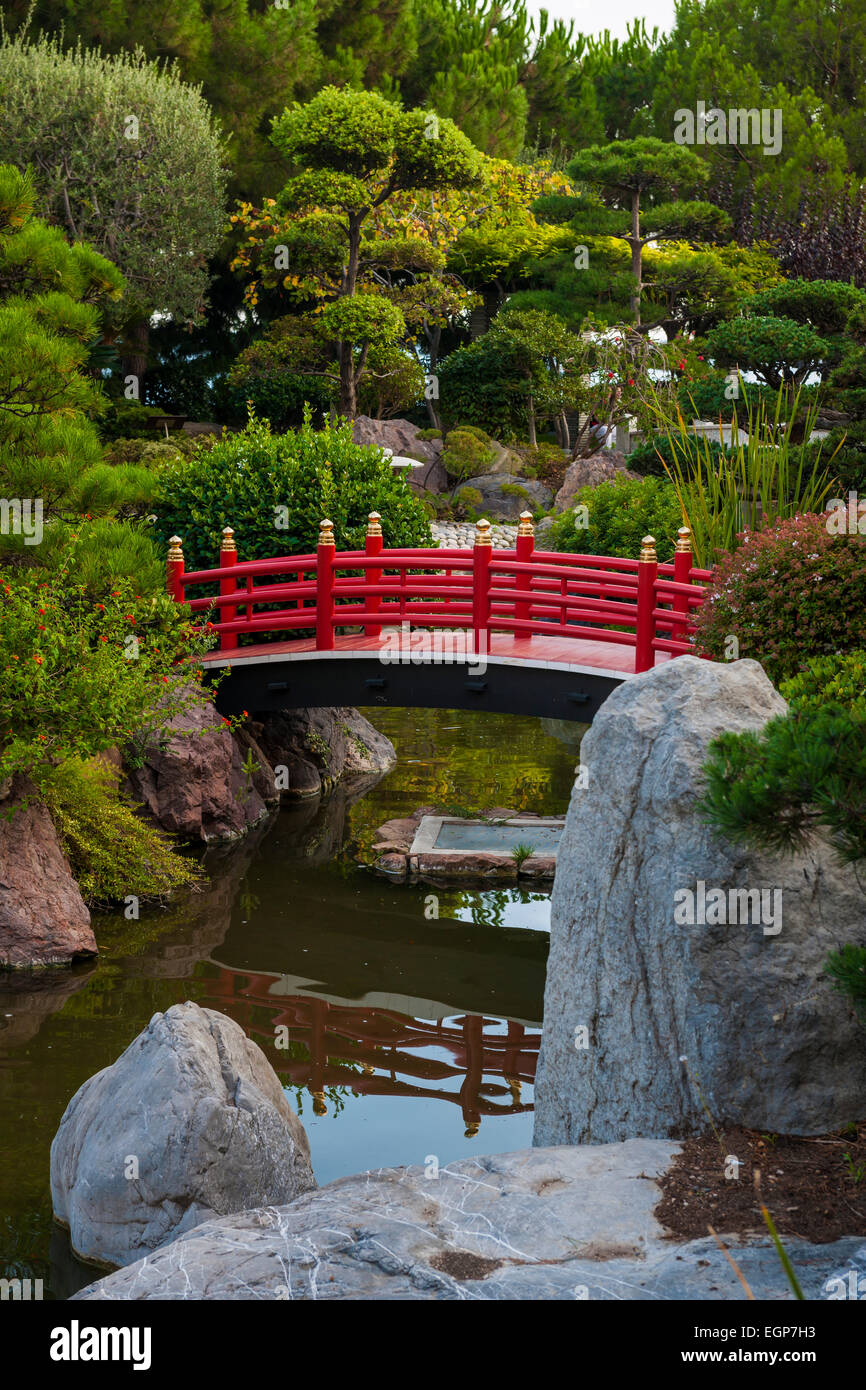 MONTE CARLO, MONACO - OCTOBER 3, 2014: View of Japanese garden with red bridge in Monte Carlo ...