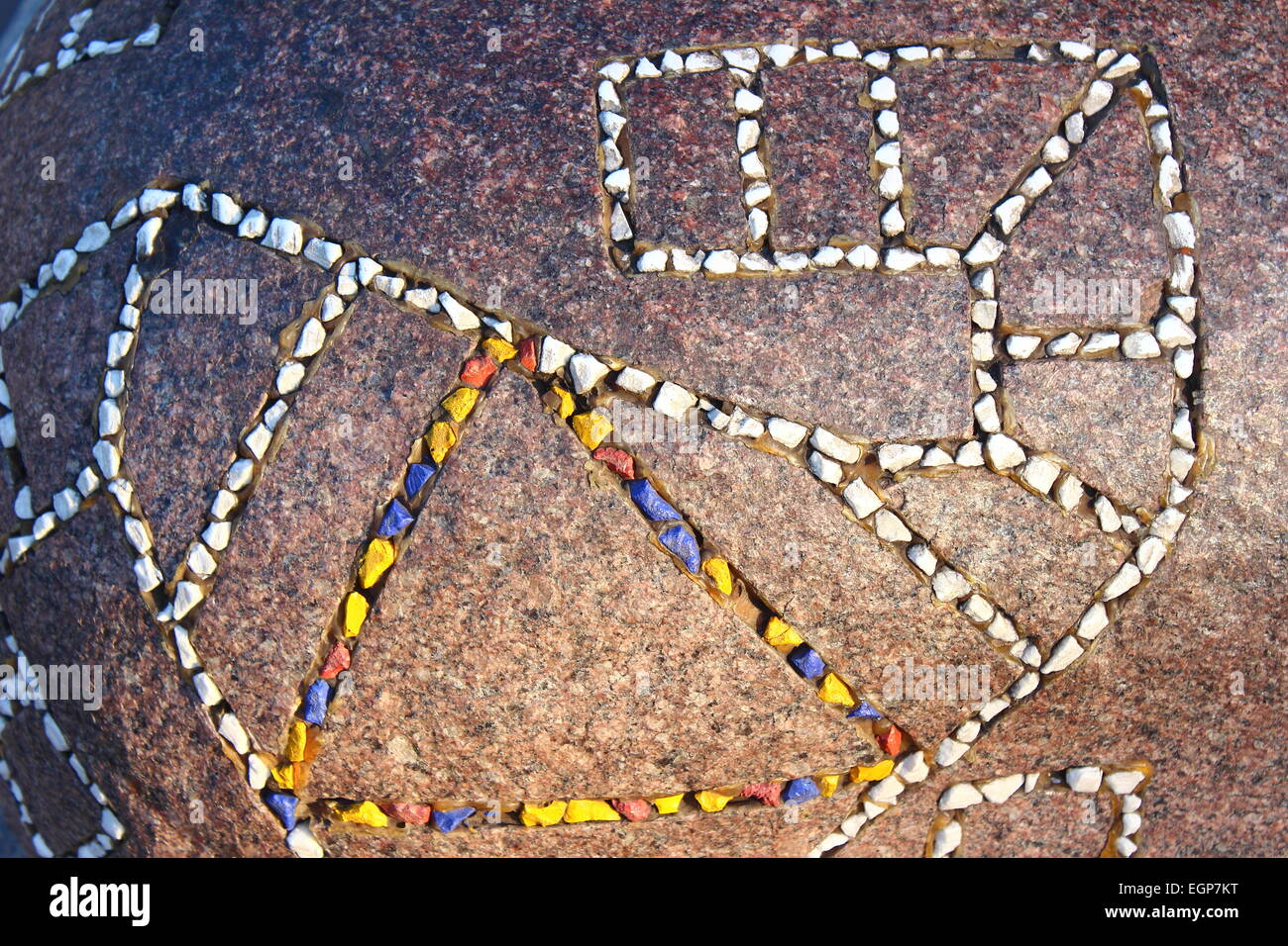 on the stone paved abstract figure of colored stones Stock Photo - Alamy
