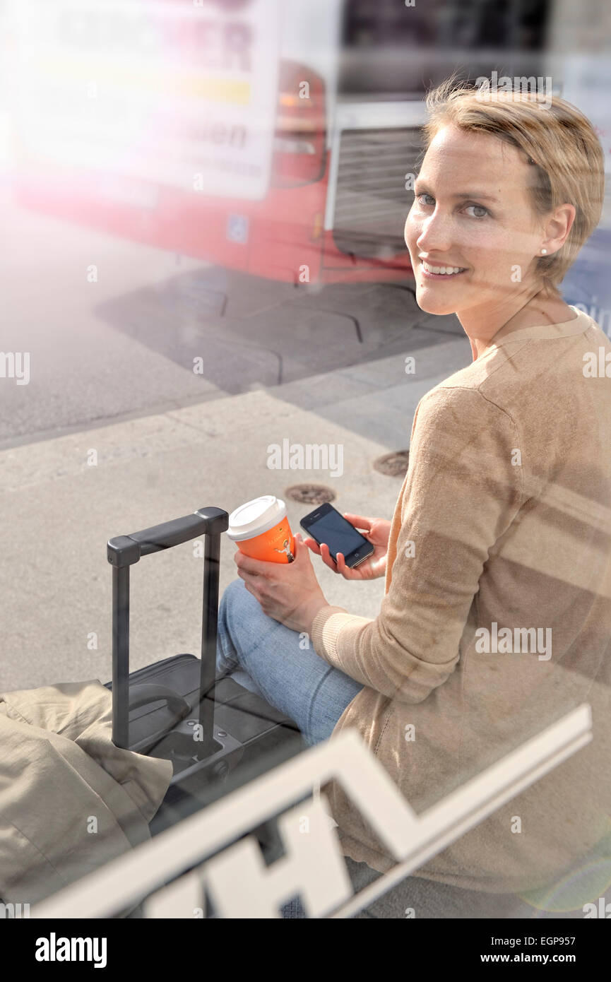 Woman getting on bus in city hi-res stock photography and images - Alamy