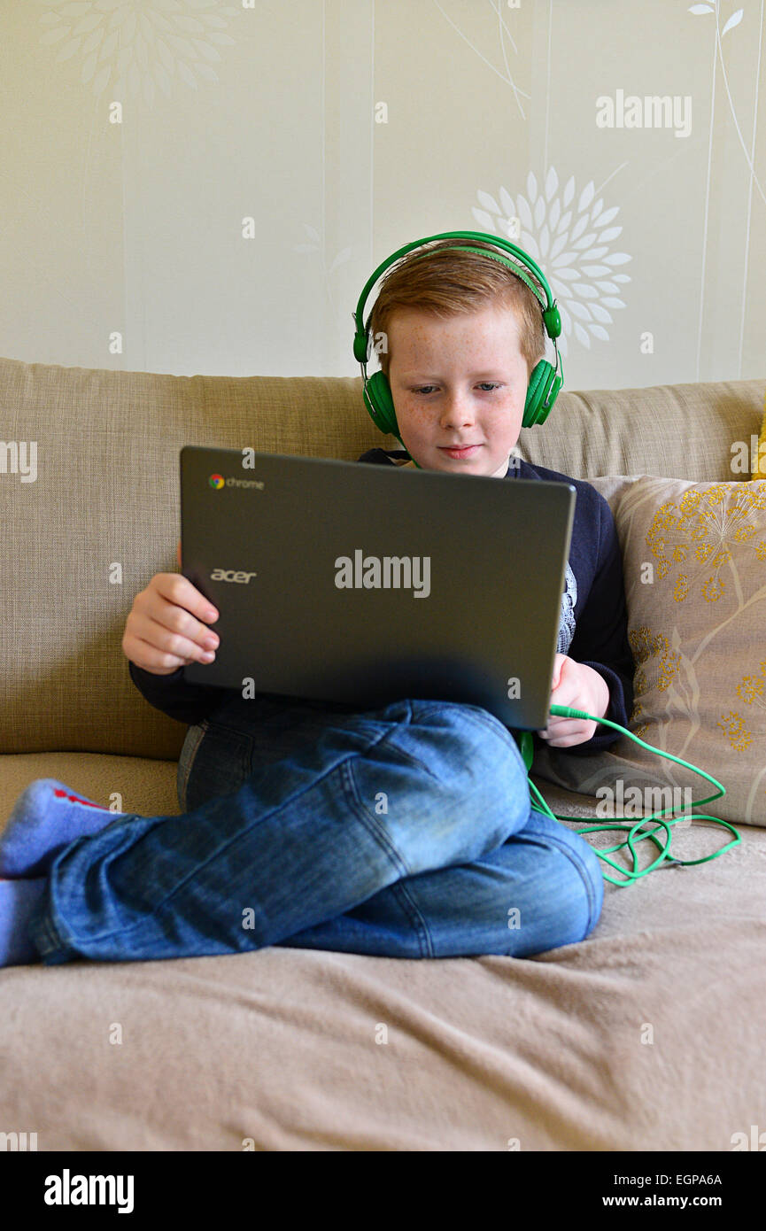 Boy playing game on laptop hi-res stock photography and images - Alamy