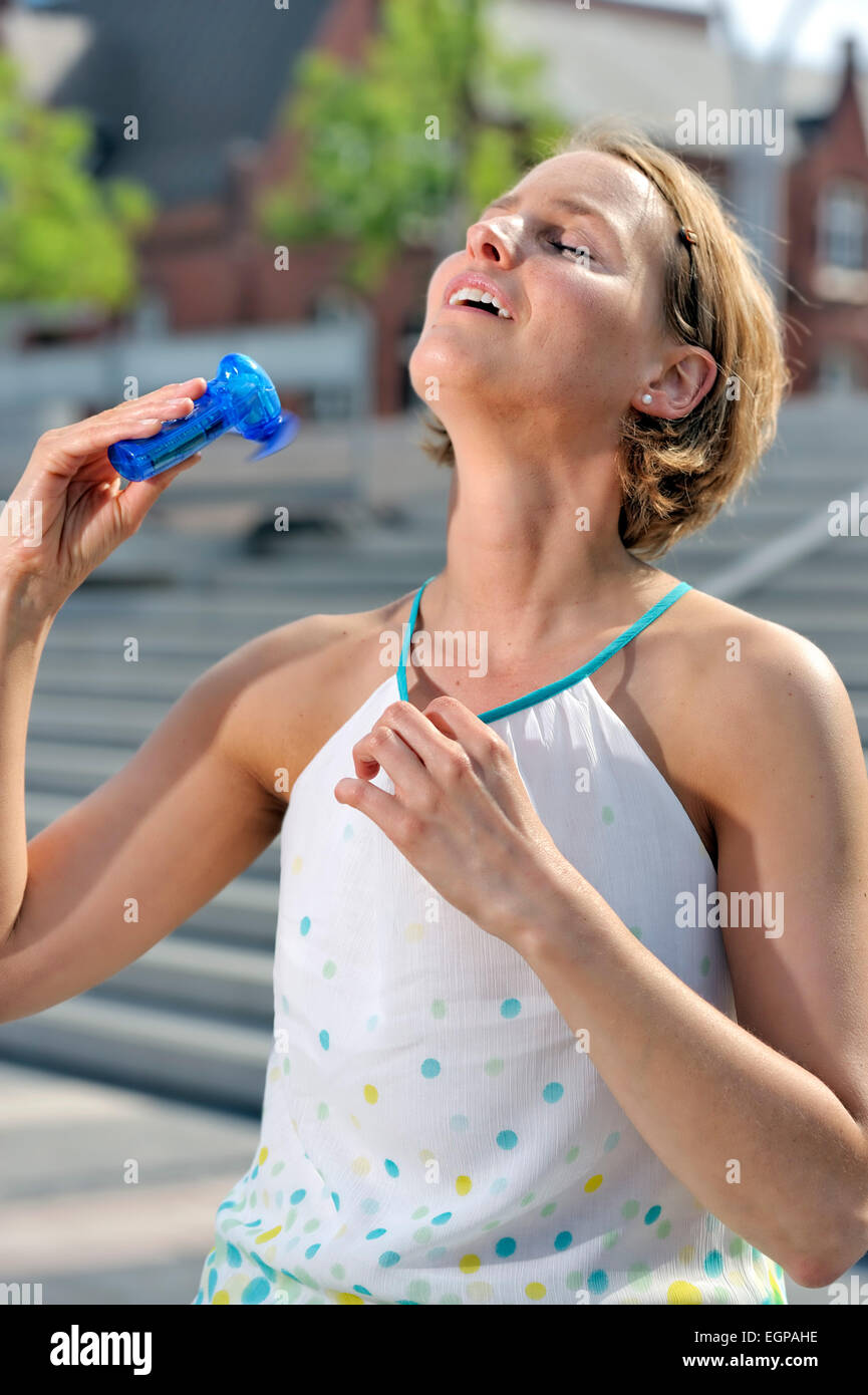 Too hot woman sweating fan hi-res stock photography and images - Alamy