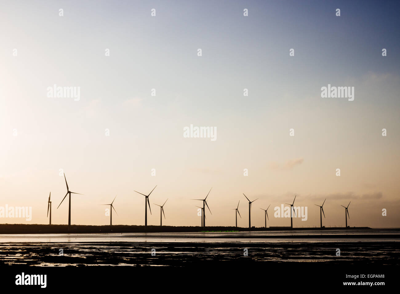 Wind turbines sunset Stock Photo - Alamy