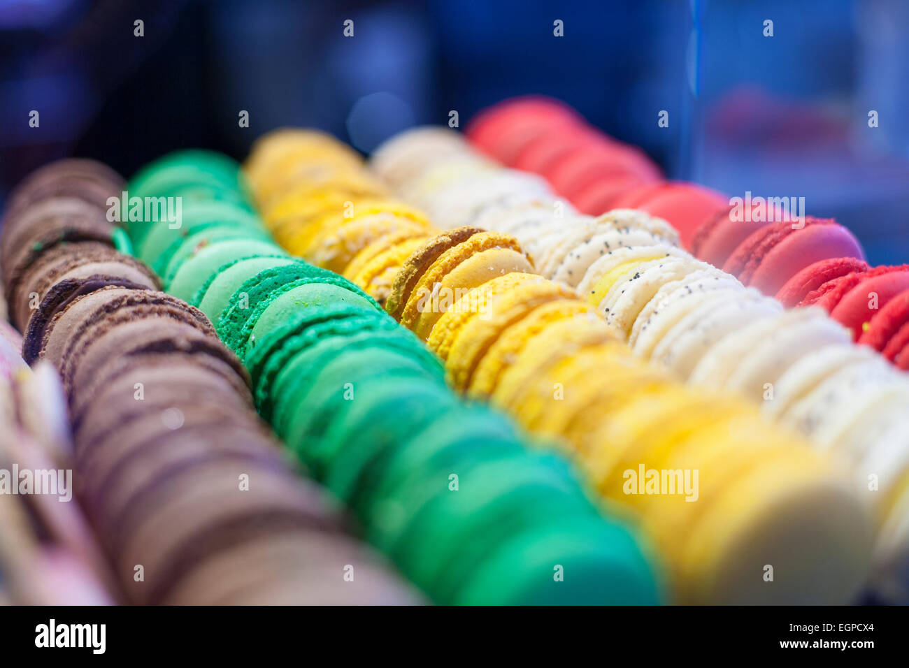 rows of color yellow green red brown macarons typical french cookies ...