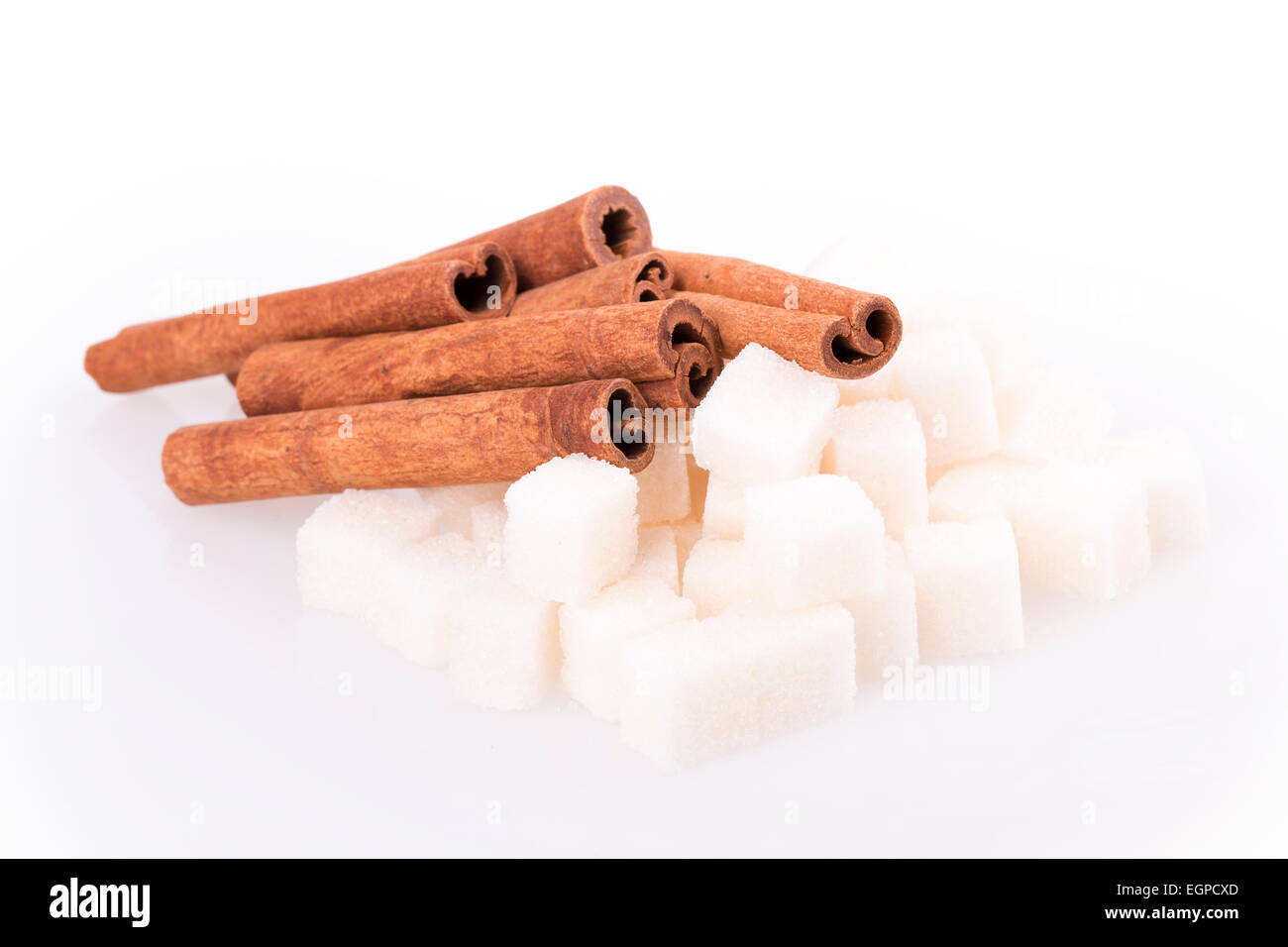 cubes of sugar and cinnamon isolated on white background Stock Photo ...