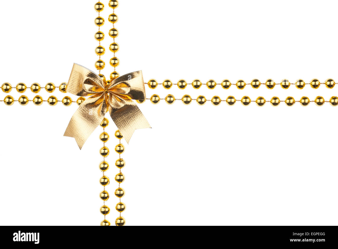 Golden beads with bow isolated on white background Stock Photo - Alamy