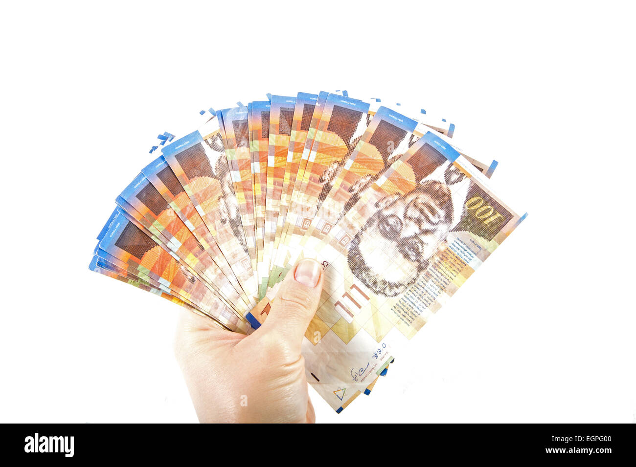 A female hand holding One hundred shekel bank notes against white ...