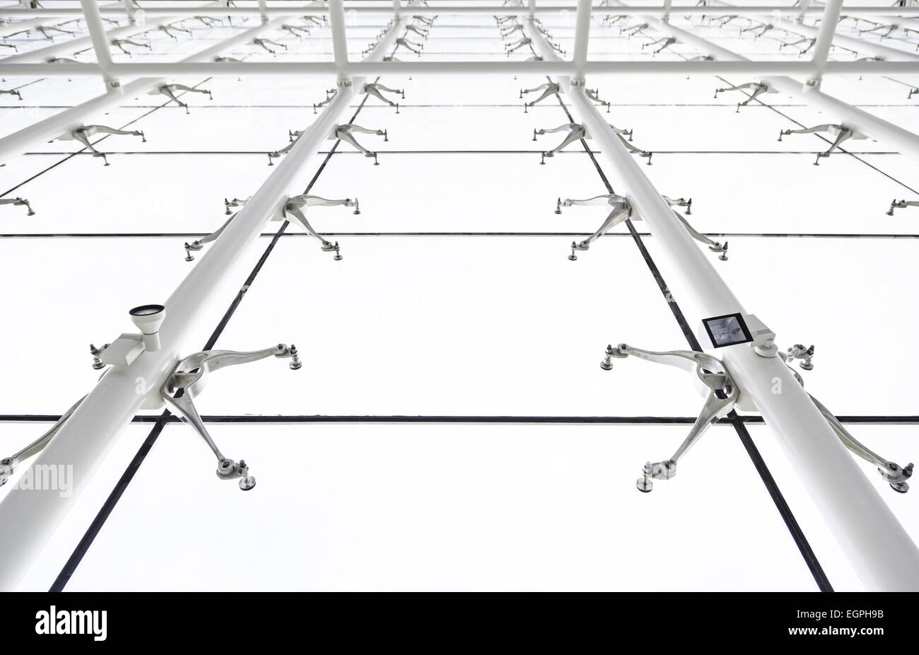 Glass roof with white beams, detail of a roof with sky views, safety ...