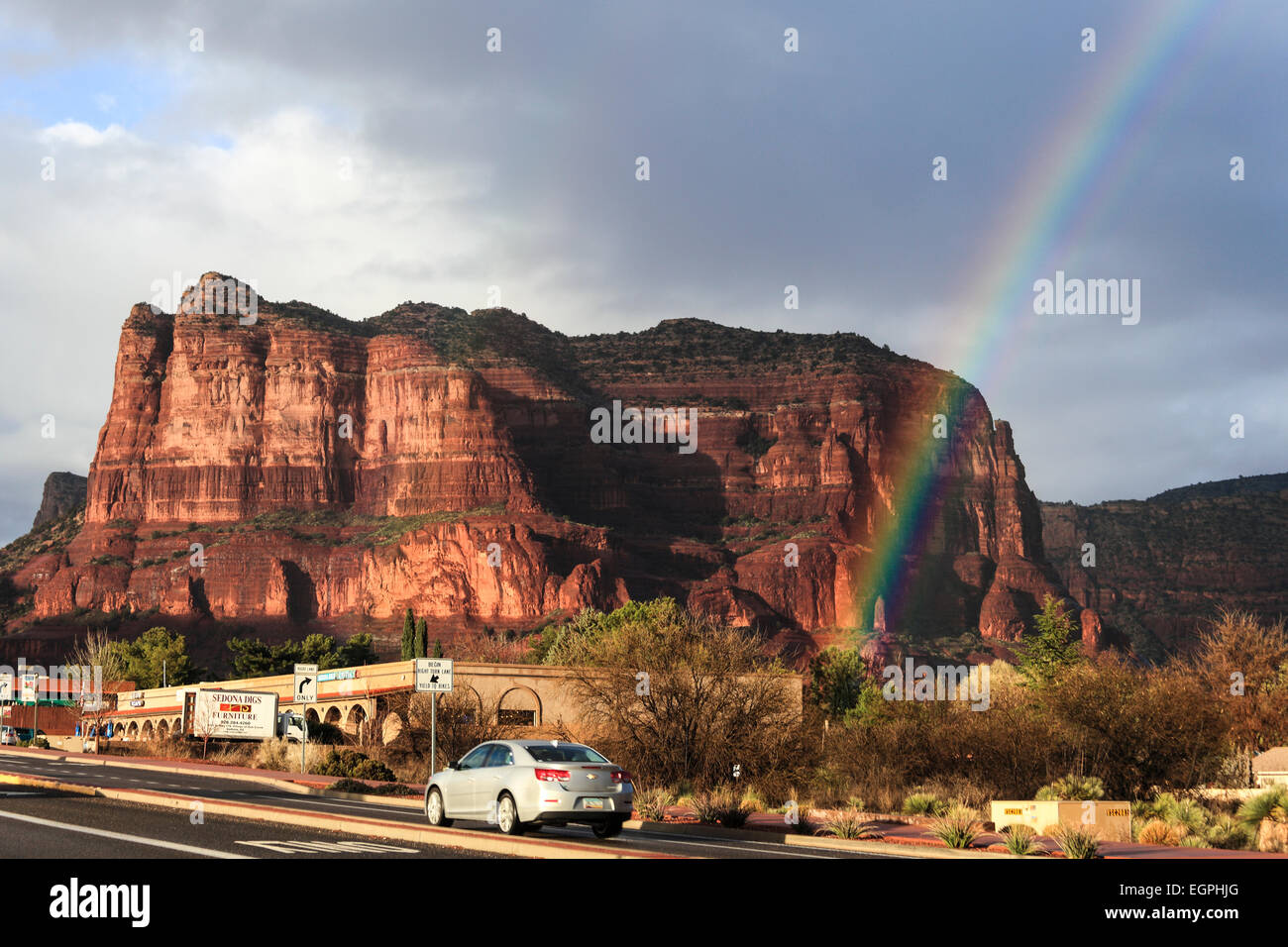 Rainbow at Courthouse Butte in the Village of Oak Creek, with car on ...