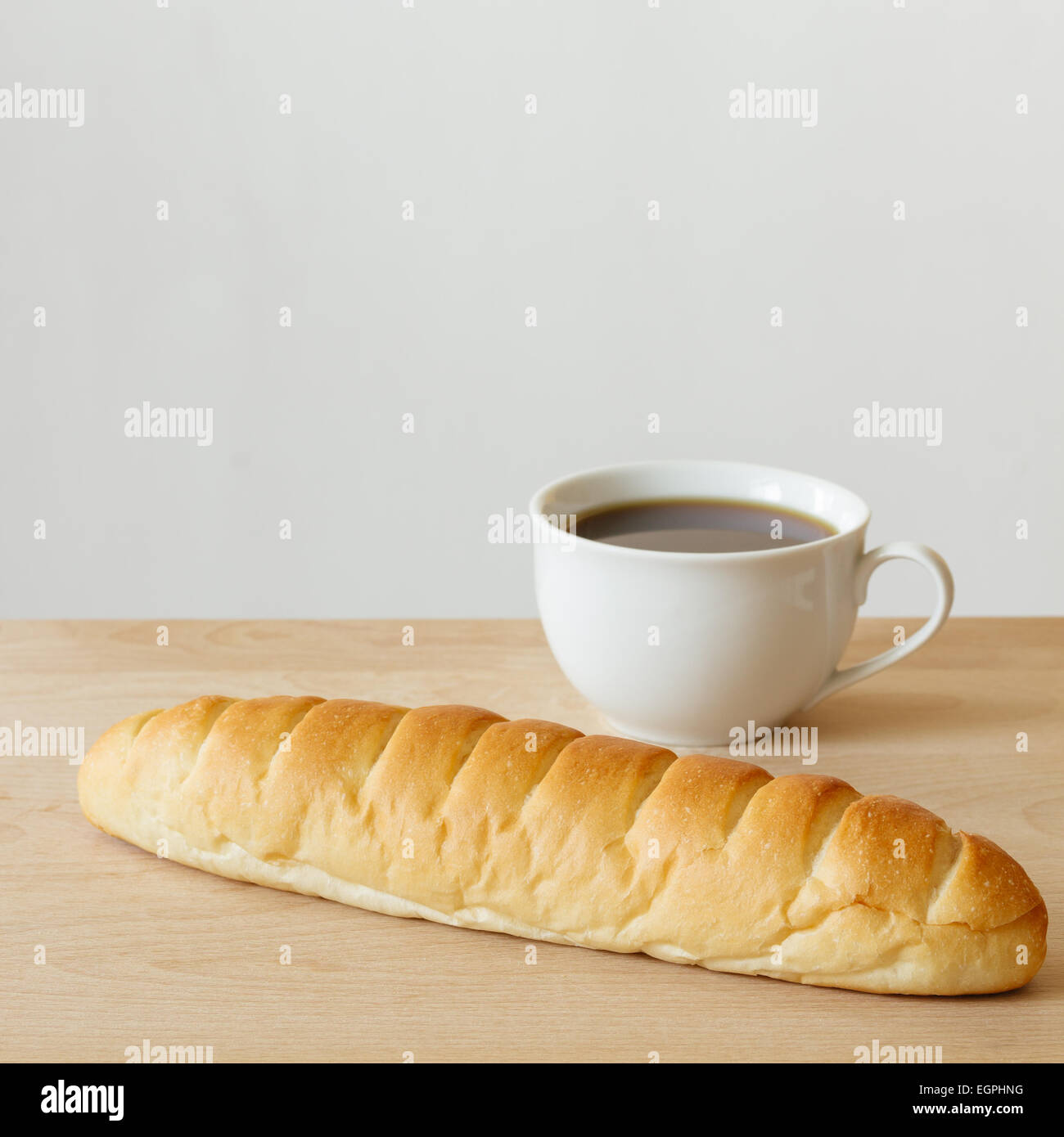 bread and coffee on wooden white background Stock Photo - Alamy