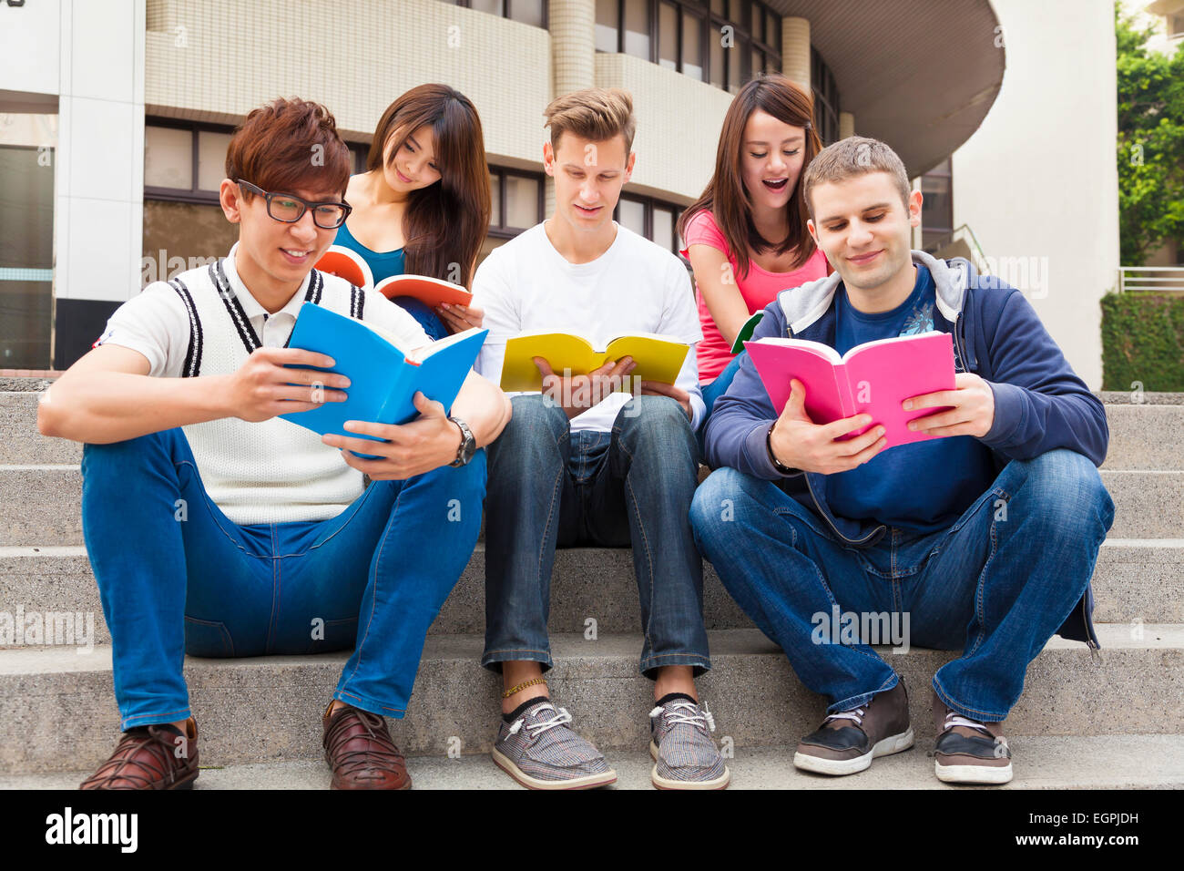 Happy young group of students study together Stock Photo - Alamy