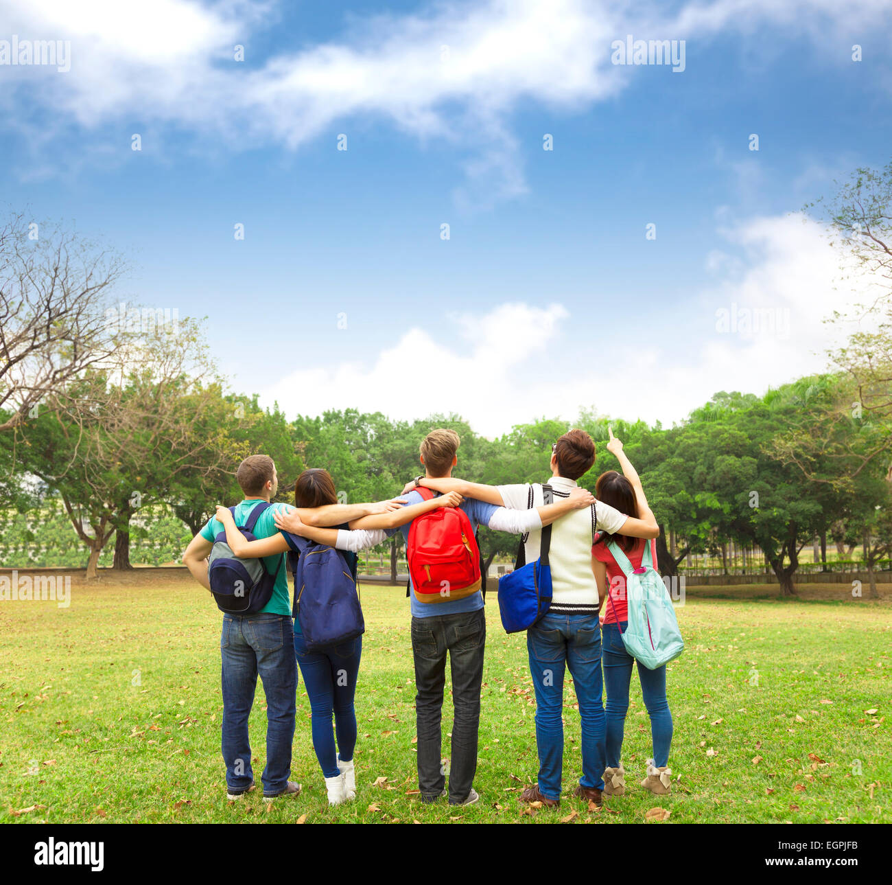 Happy young group of students watching the sky Stock Photo - Alamy