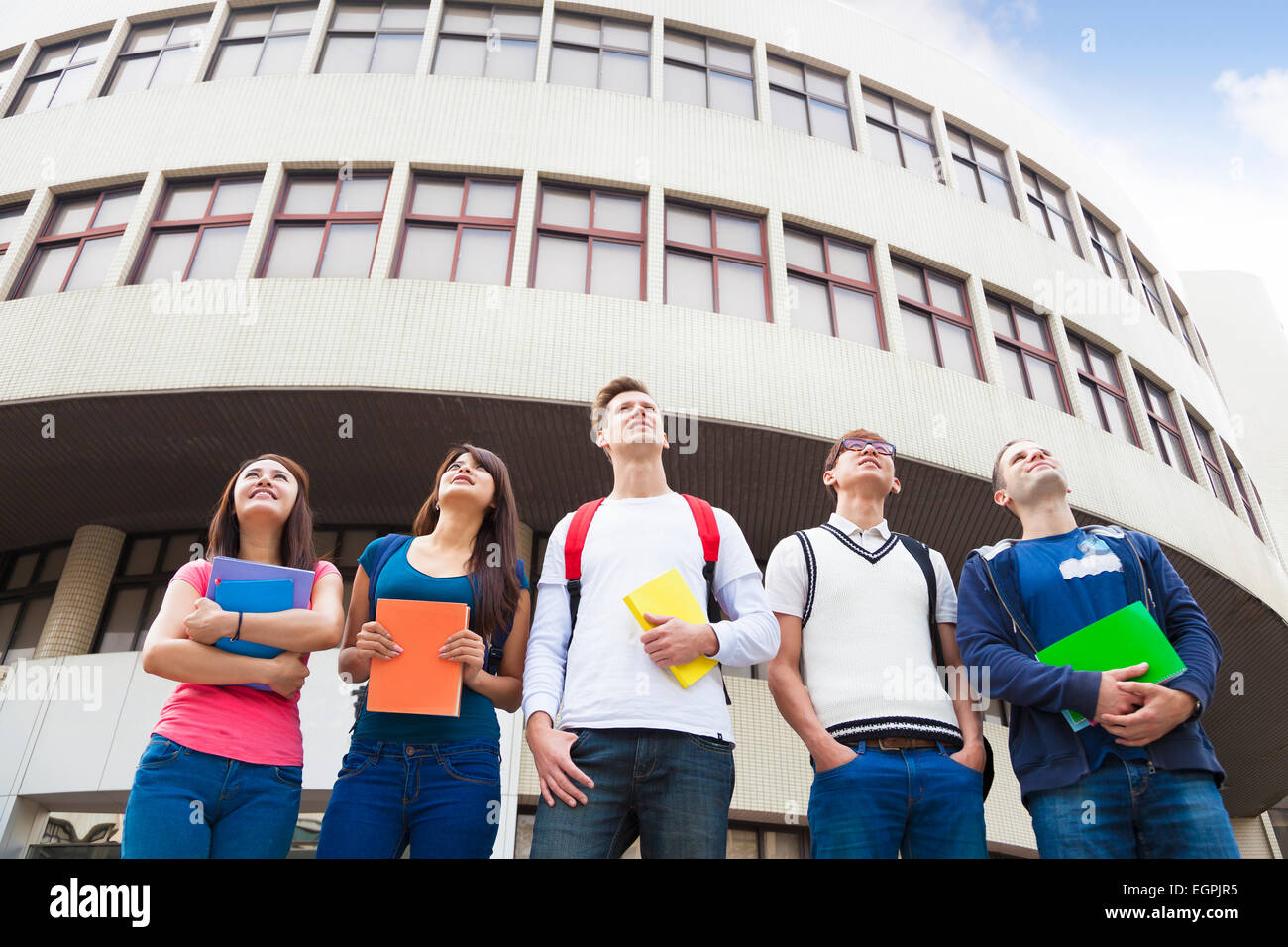 Happy group of students standing together Stock Photo - Alamy