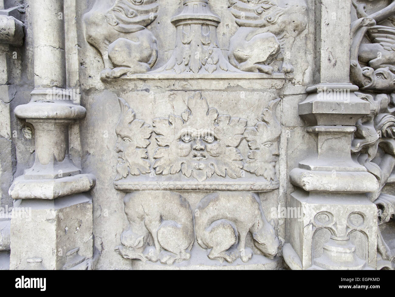 Carved stone figures, detail of a decorated stone wall, background with ...