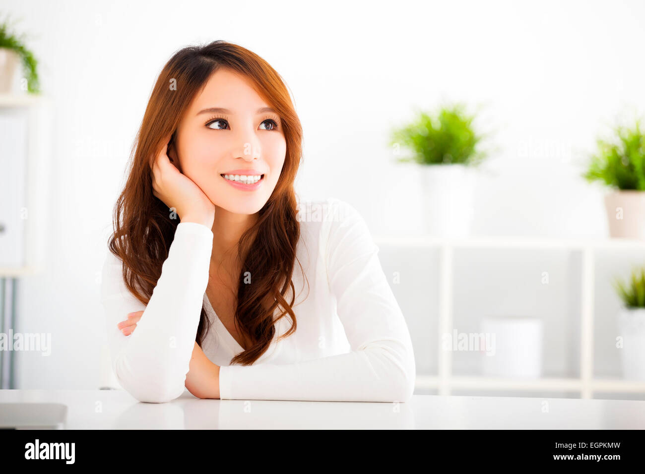 beautiful young asian woman thinking something Stock Photo - Alamy