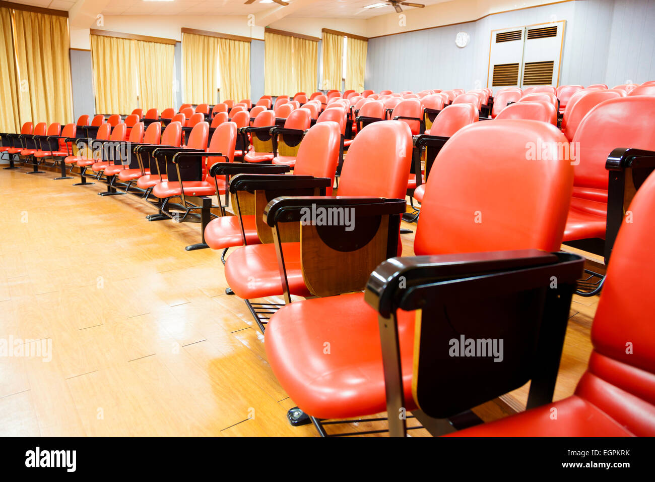 Interior of empty conference hall with red chairs Stock Photo - Alamy