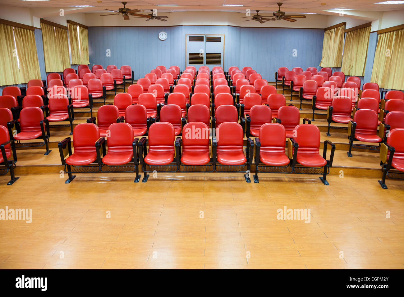 Interior of empty conference hall with red chairs Stock Photo - Alamy