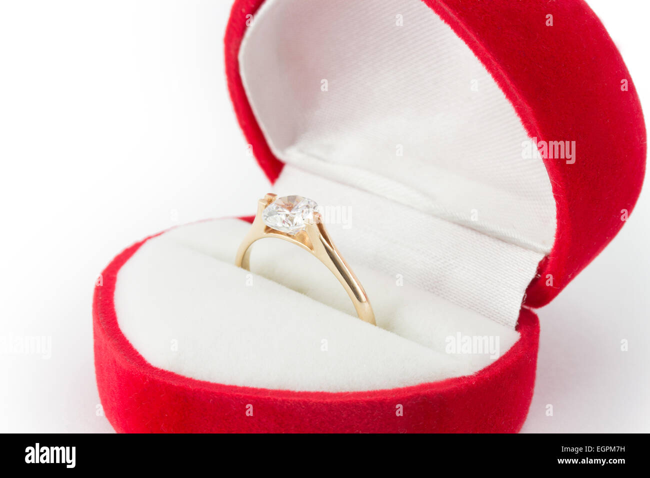 gold wedding ring in a red gift box Stock Photo - Alamy