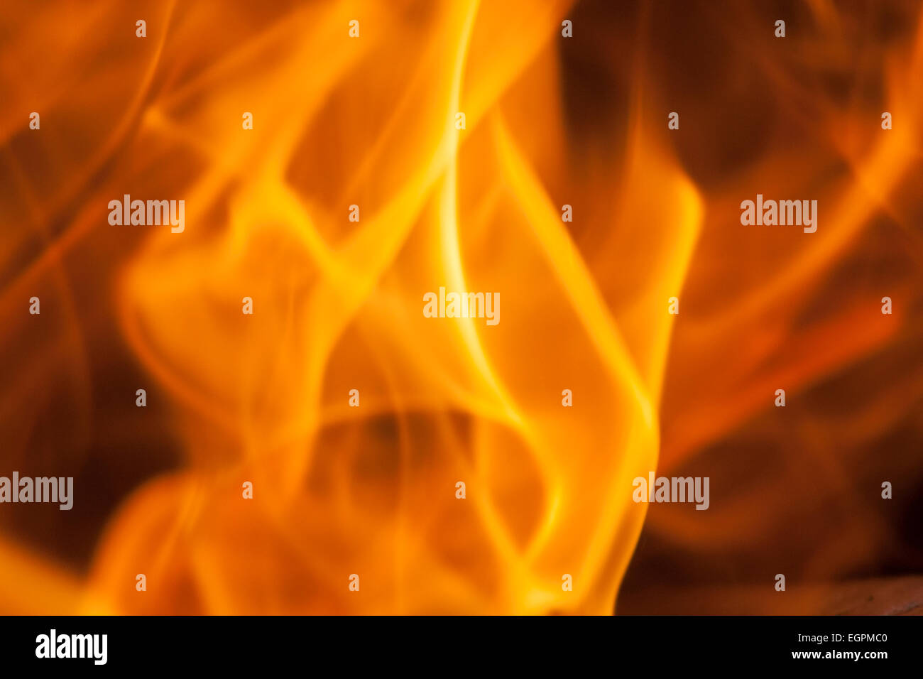 Flames from burning wood dancing yellow and orrange Stock Photo - Alamy