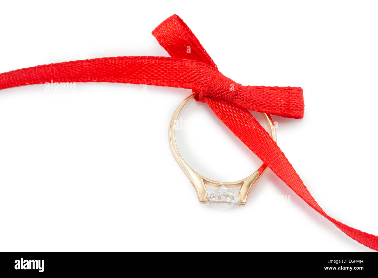gold ring and a red ribbon with a bow Stock Photo - Alamy
