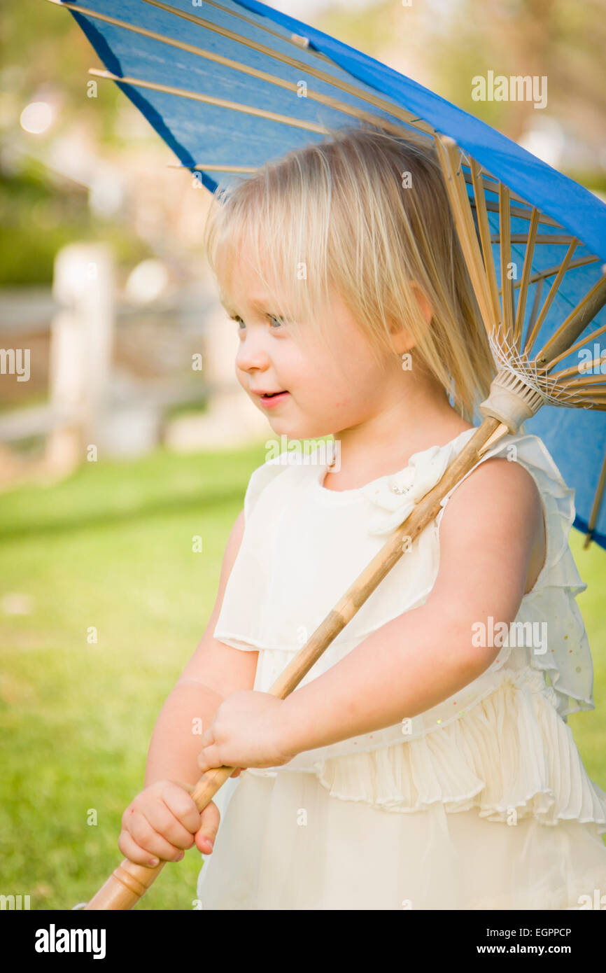 Playful Cute Baby Girl Holding Parasol Outside At The Park Stock Photo ...
