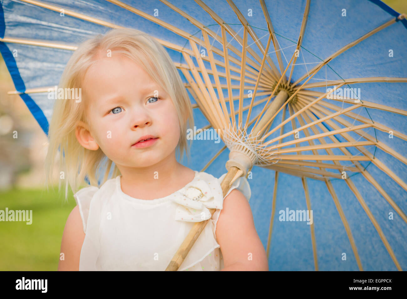 Playful Cute Baby Girl Holding Parasol Outside At The Park Stock Photo ...