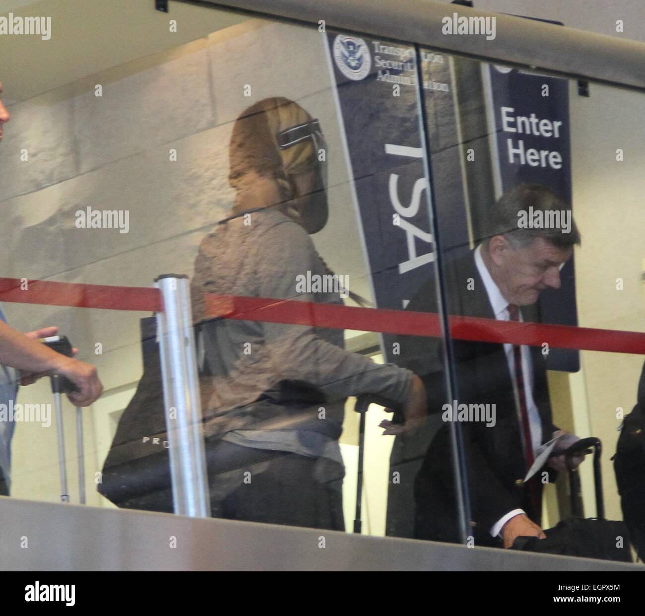 Laverne Cox wears a face visor as she leaves Los Angeles International ...