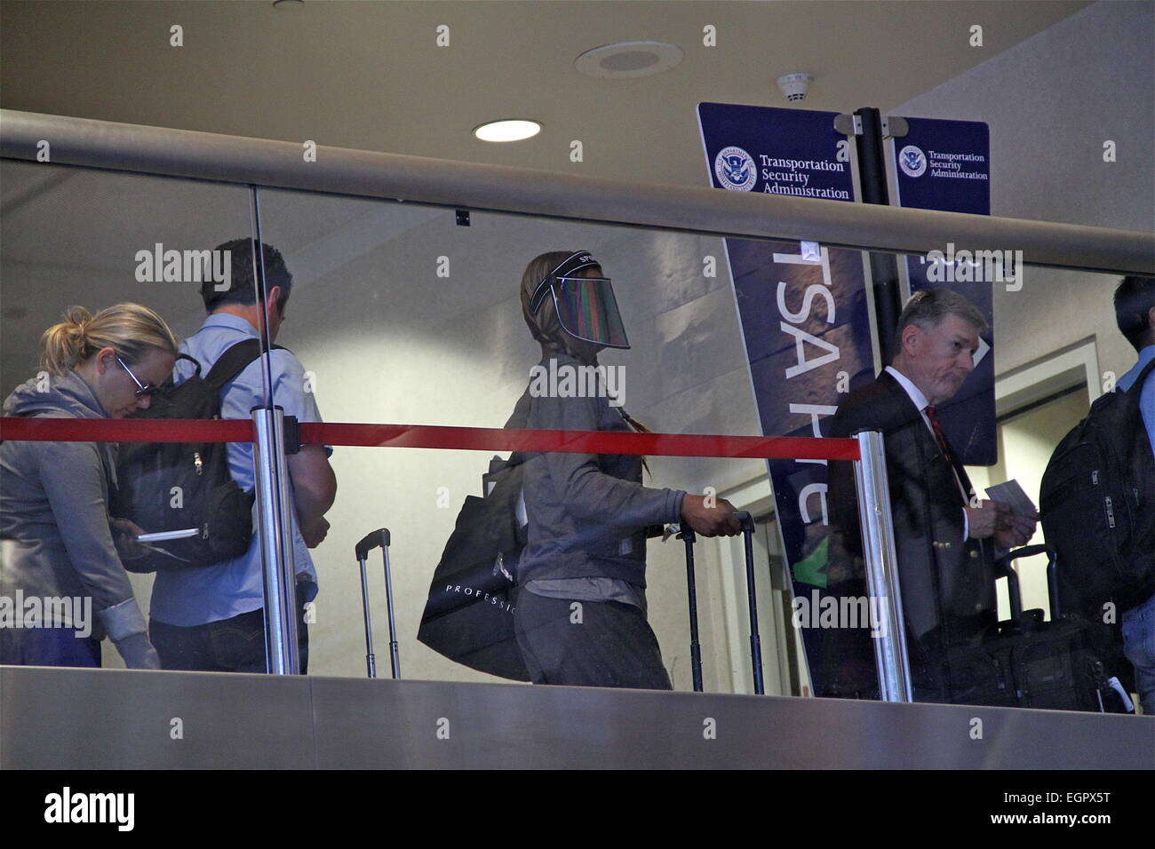 Laverne Cox wears a face visor as she leaves Los Angeles International ...