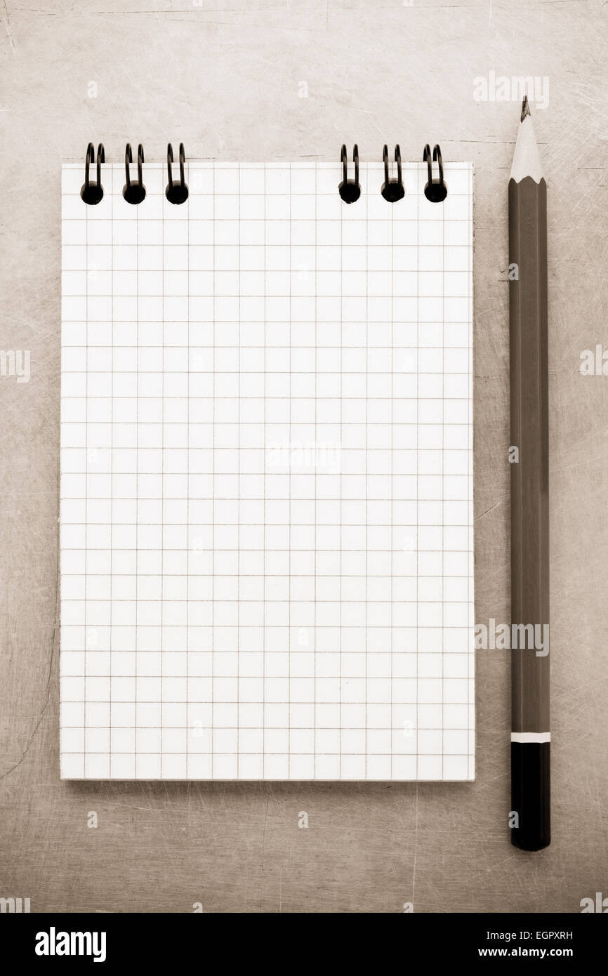 checked notebook at metal background texture Stock Photo - Alamy